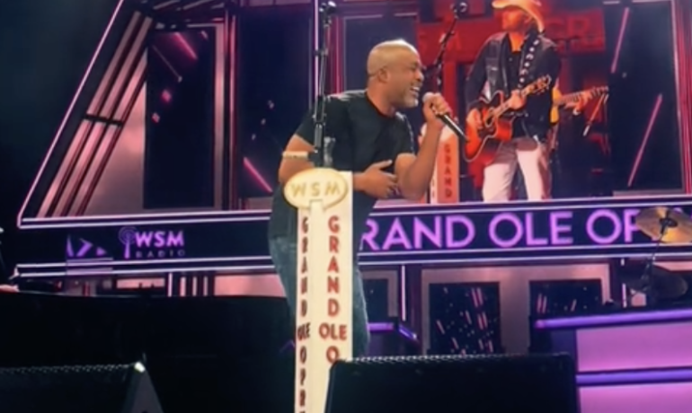 WATCH: Darius Rucker Pays Tribute To Toby Keith With Performance of "God Love Her" Live At The Opry